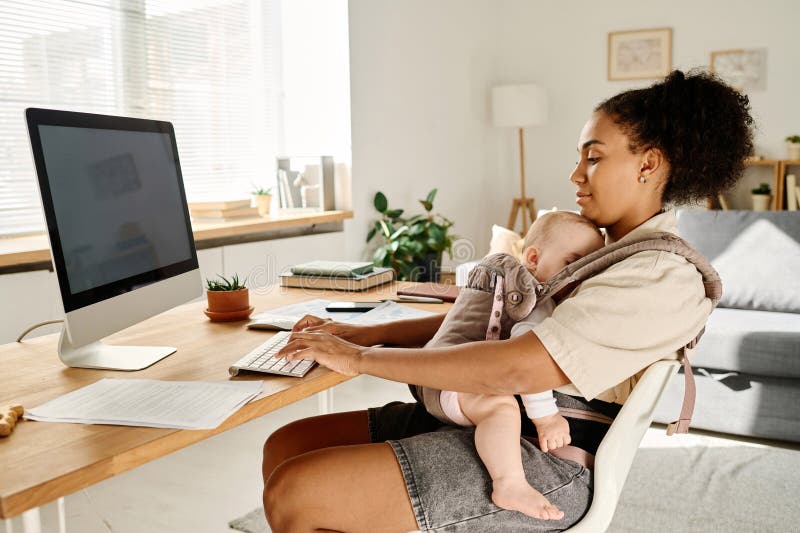Mom Working on Computer with Her Baby Stock Photo - Image of sling ...