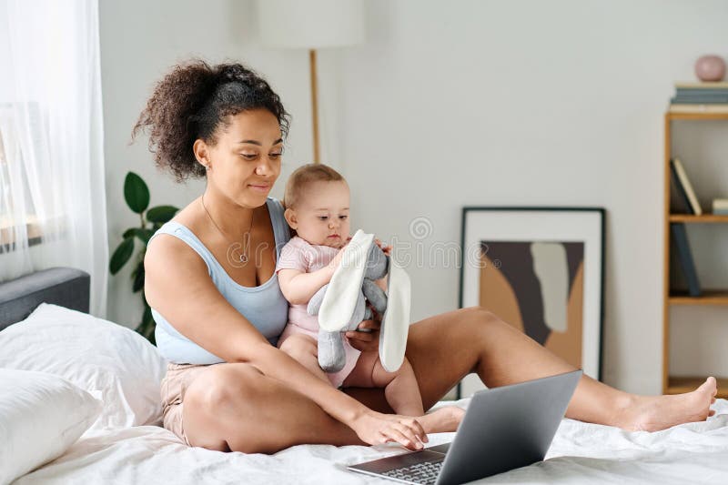 Mom Working on Laptop at Home Stock Photo - Image of watch, typing ...