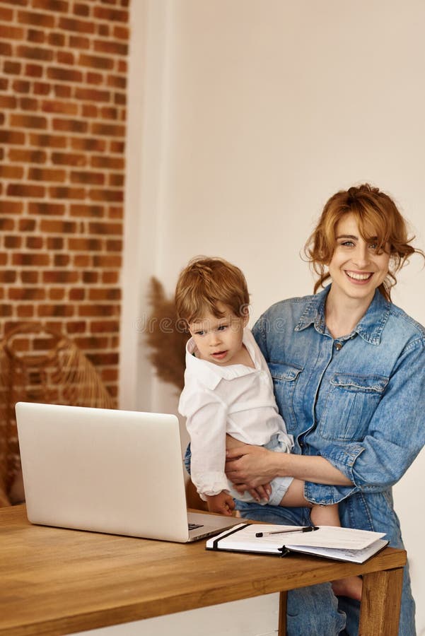 Mom works at the computer stock photo. Image of childhood - 216554886