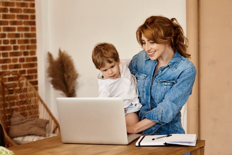 Mom works at the computer stock image. Image of lifestyle - 216554909