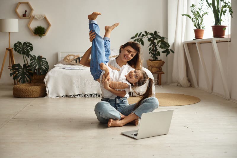 Mom Works at the Computer while Playing with Her Daughter Stock Image ...