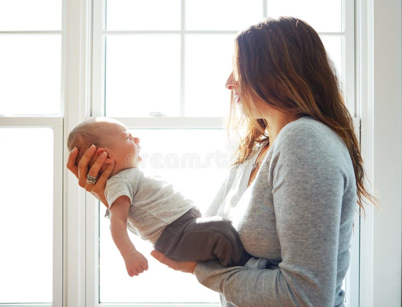 Mommys Bundle of Joy. a Mother Holding Her Newborn Baby. Stock Image ...