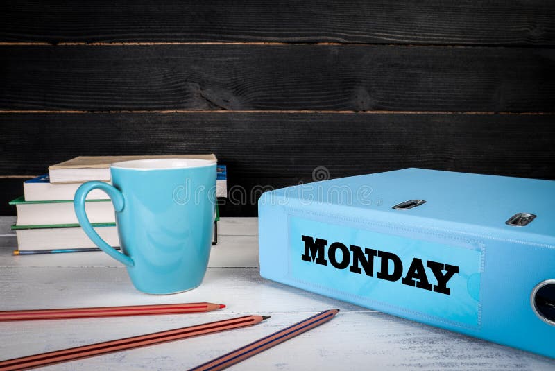 Monday. Document Folder and Office Supplies on a Wooden Table Stock ...