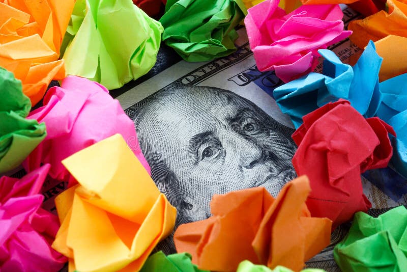 Monetization and Creative Economy. Colored Paper Balls and a Dollar ...