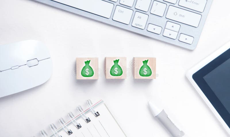 Money Bag on Wooden Cubes and Business Objects Stock Image - Image of ...