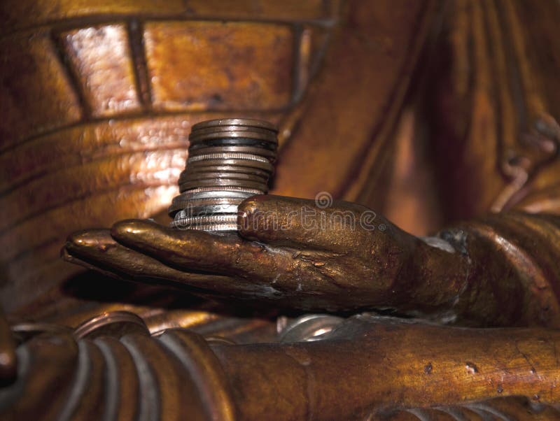 Money in Buddhas Hand stock photo. Image of offering - 12702960
