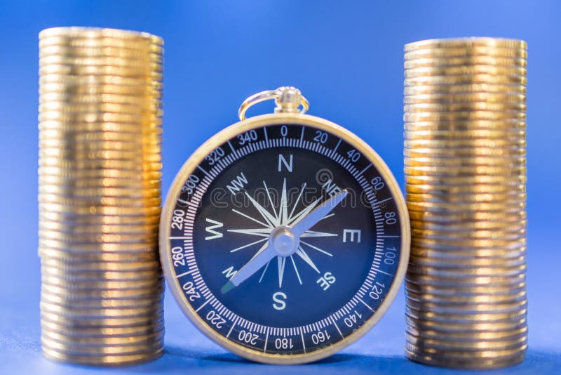 Money, Business and Direction and Planning Concept. Closeup of Compass ...