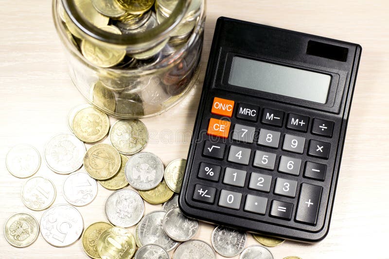Money and calculator stock photo. Image of change, coins - 89373750