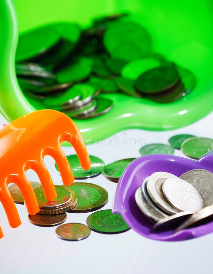 Money and child s bucket stock image. Image of sands, rake - 9557465