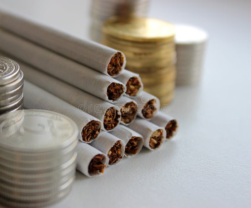 Money in Coins and Cigarettes in Bulk As a Symbol of Increasing Prices ...