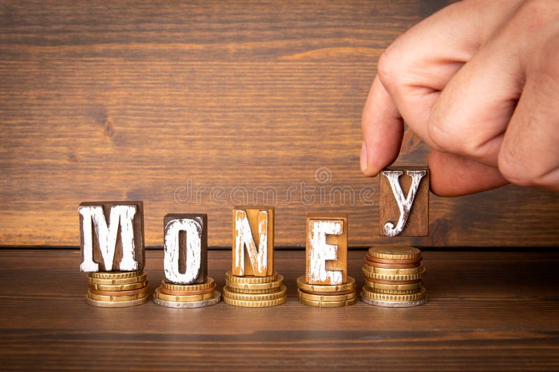 MONEY Concept. Text from Wooden Alphabet Letters and Change Stock Photo ...