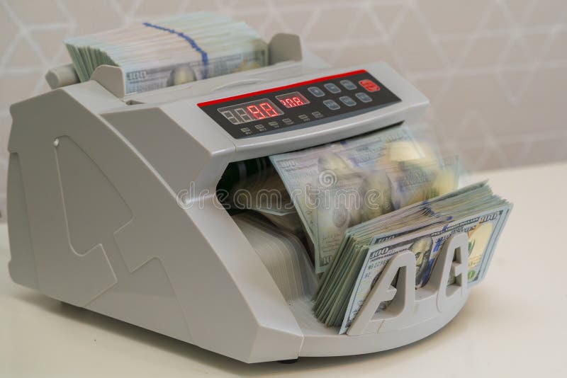 Money Counting Machine in Action at a Financial Office Setting Stock ...
