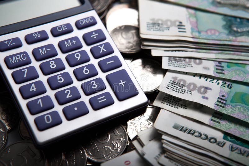 Money in the Form of Banknotes and Coins with Calculator Stock Image ...