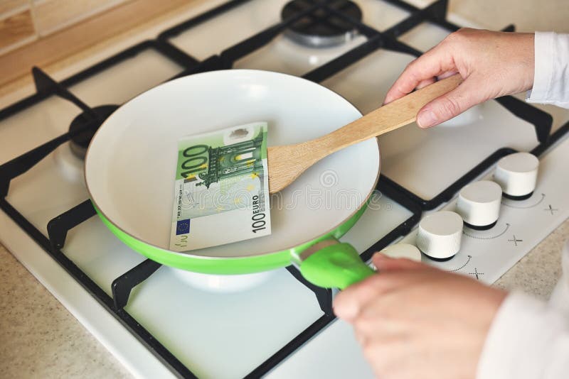 Money is fried in a pan stock image. Image of financial - 187035421