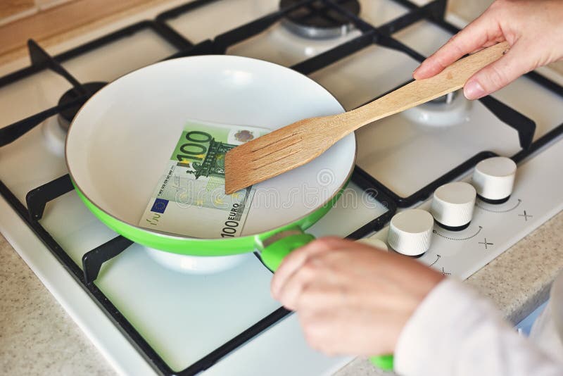 Money is fried in a pan stock photo. Image of cookware - 190847886