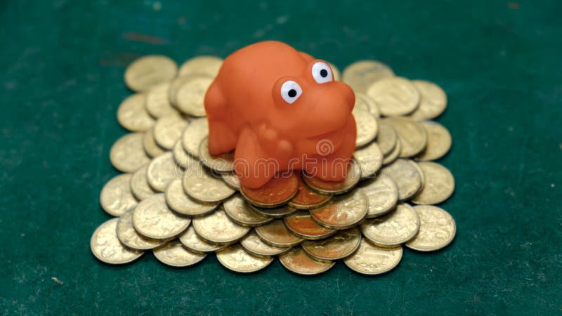 The Money Frog. Red Frog on Green Stock Image - Image of bronze, good ...
