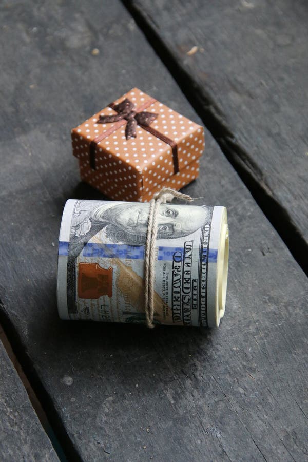 Money and a Gift on the Table Stock Photo - Image of retro, walnuts ...