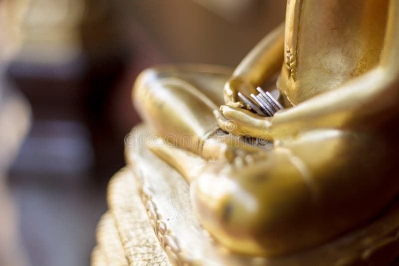 Money in hand of buddha stock photo. Image of religion - 61059794