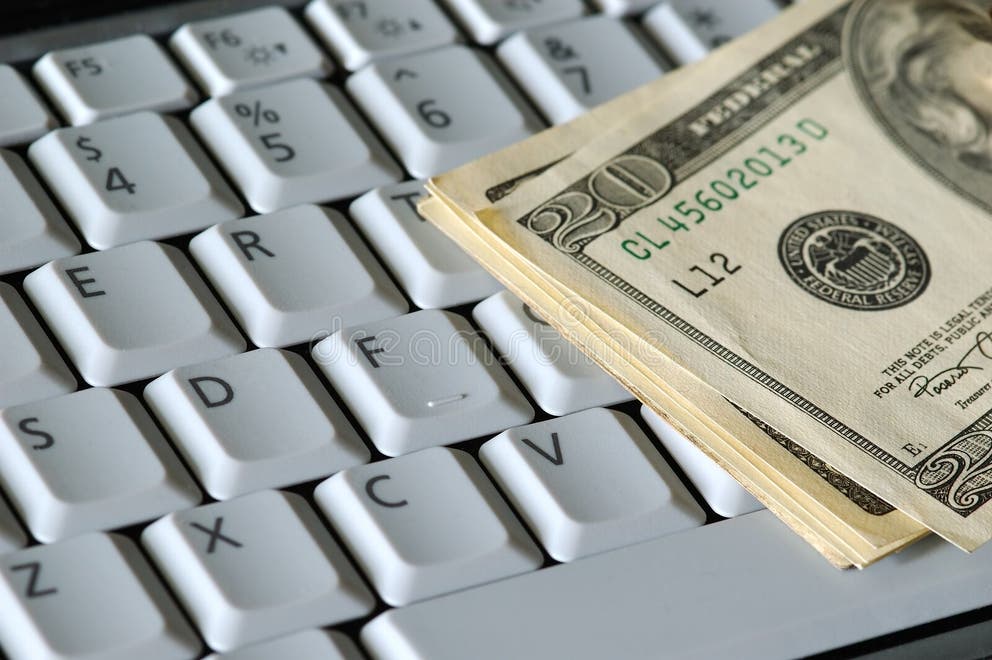 Money on a Keyboard stock image. Image of internet, hold - 492619