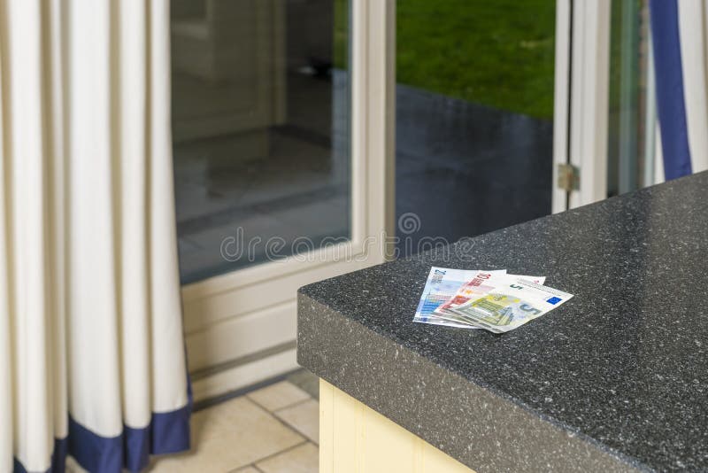 Money on a kitchen counter stock image. Image of thief - 36786037