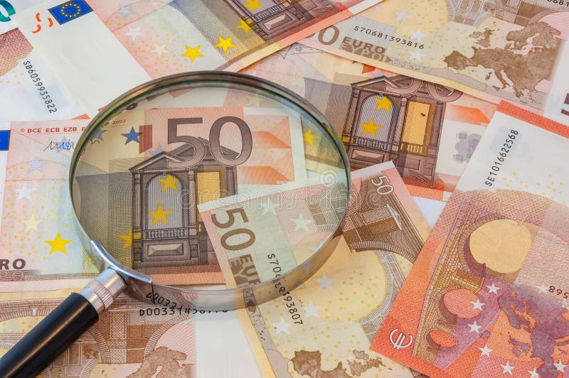 Money and a magnifier stock photo. Image of currency - 60095416