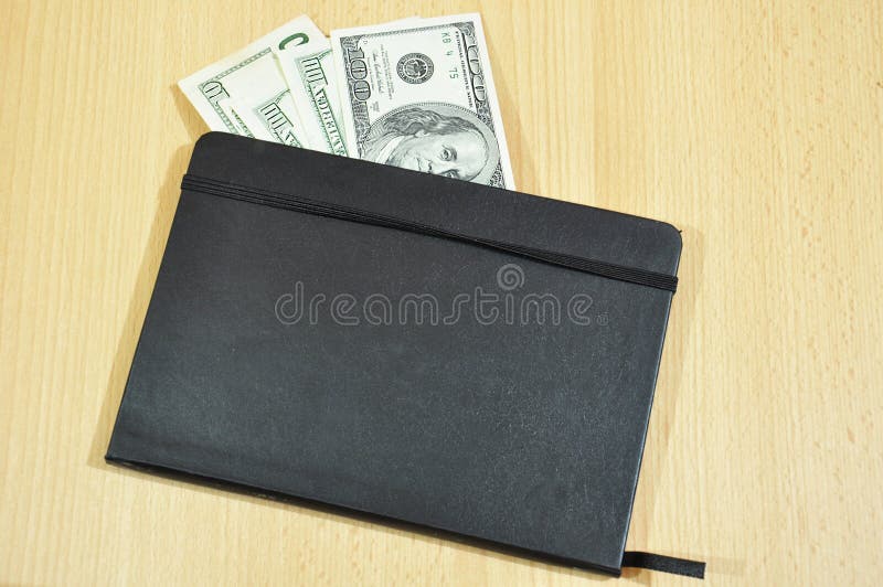 Money in notebook stock photo. Image of visible, notepad - 30323494