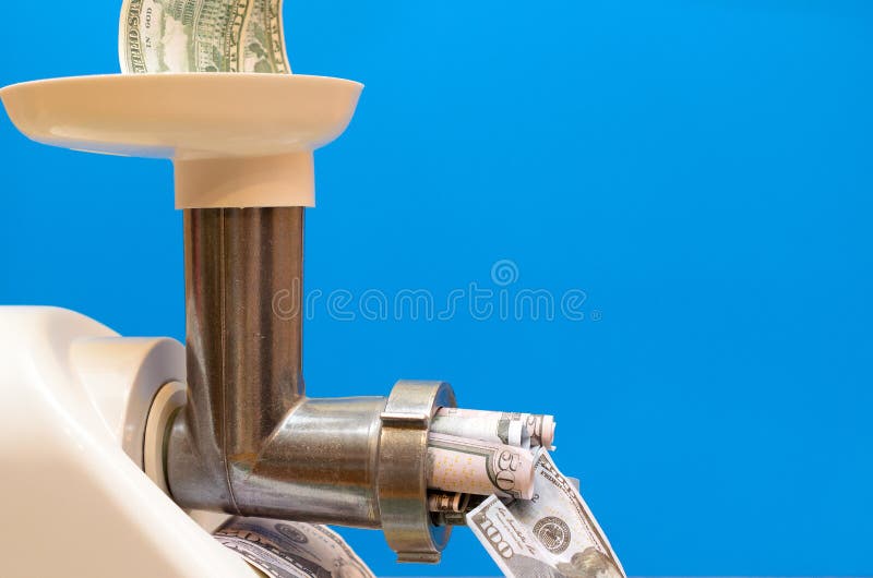Money Passes through a Meat Grinder. Blue Background. Stock Image ...