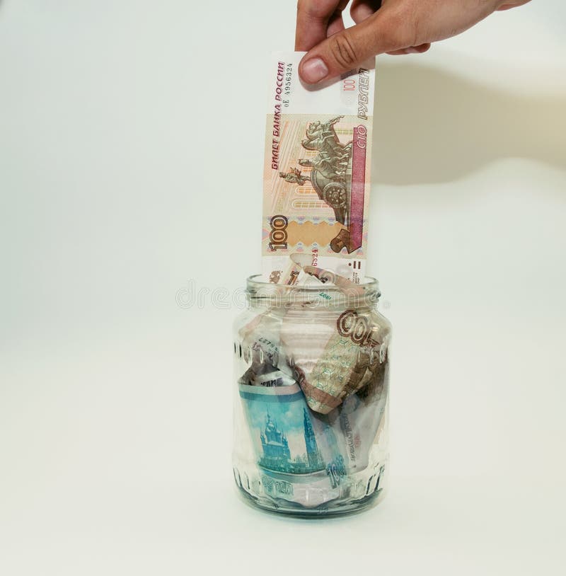 Money is Poured into a Glass Jar Filled with Banknotes Stock Photo ...