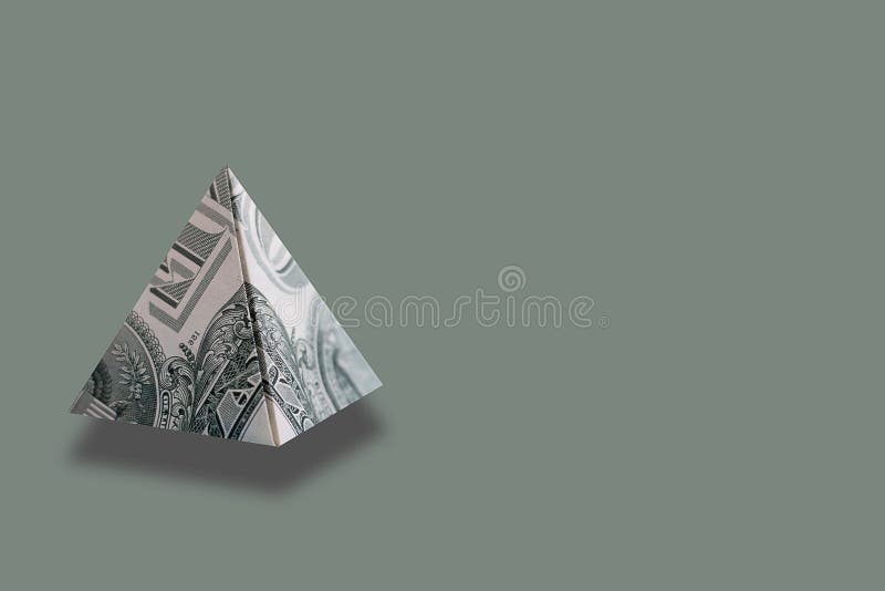 Money Pyramid on Green Background. Copy Space. Stock Image - Image of ...