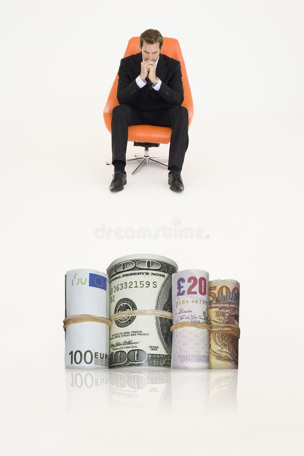 Money Rolls with Pensive Businessman on Chair Representing Financial ...