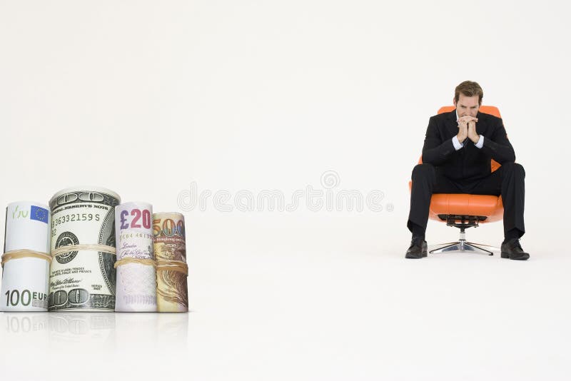 Money Rolls with Pensive Businessman on Chair Representing Financial ...