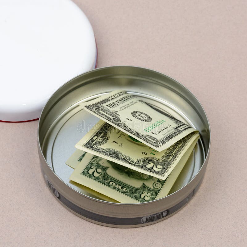 Money in round tin stock image. Image of home, dollar - 70365345