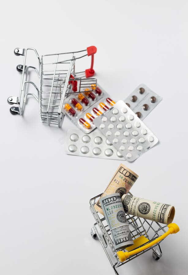 Money and Tablets in Shopping Carts on a White Background with Place ...