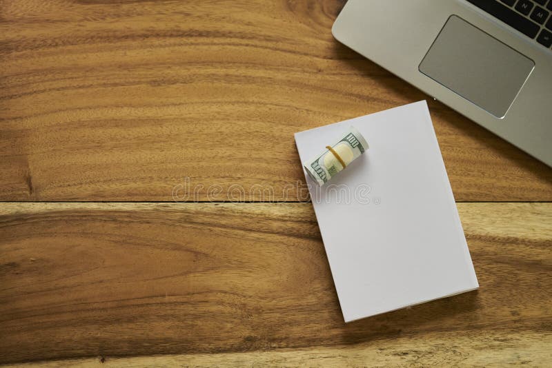 Money on Top Laptop and Book Stock Photo - Image of book, copy: 78698532