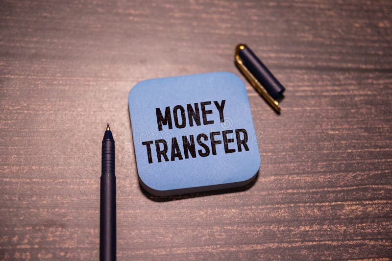 MONEY TRANSFER Text on Notepad with Stickers. White Cup of Coffee and ...