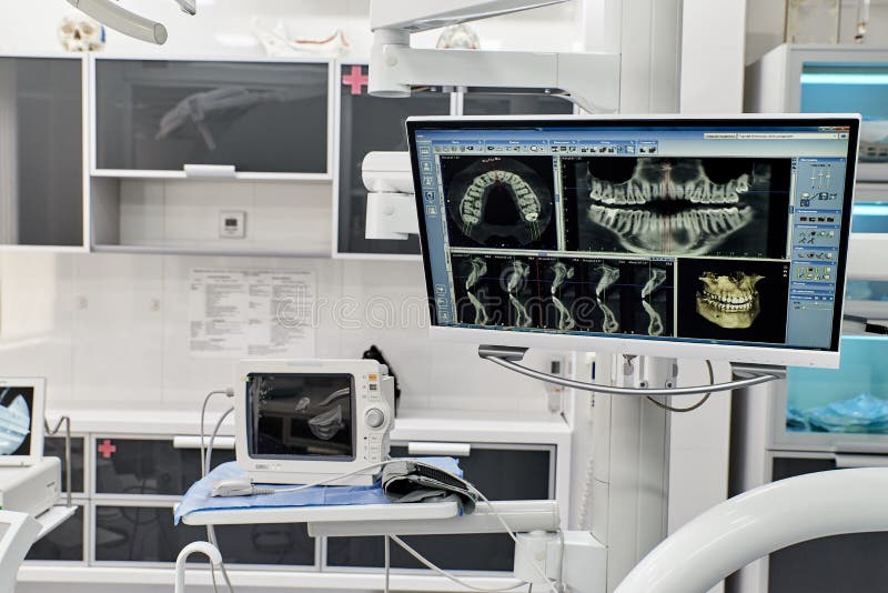 Monitor with Pictures of Teeth and Other Equipment in the Dental ...