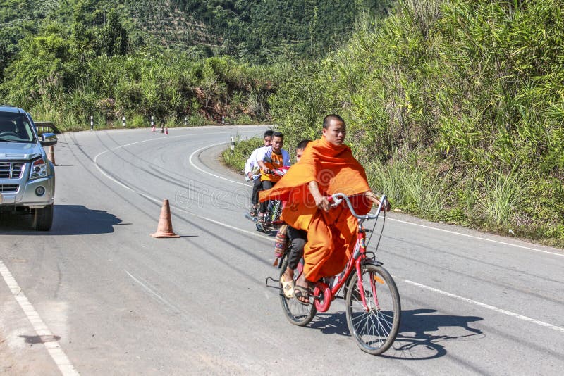Monk with bicycle editorial stock photo. Image of bike - 42824858