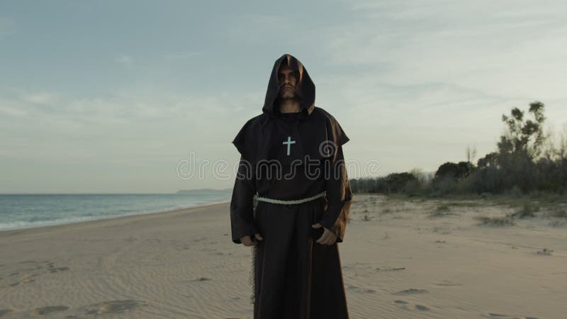 Monk Kneels on the Beach and Starts Praying Stock Image - Image of ...