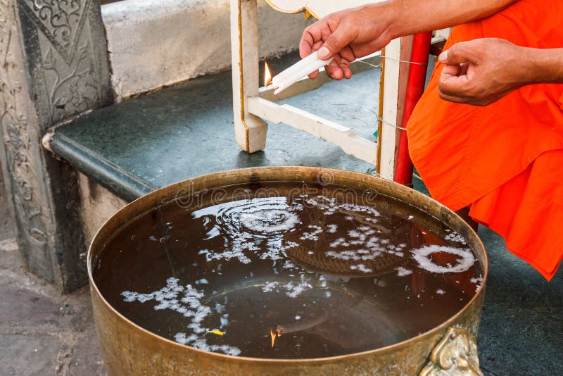 Monk making holy water. stock image. Image of blessing - 70229615