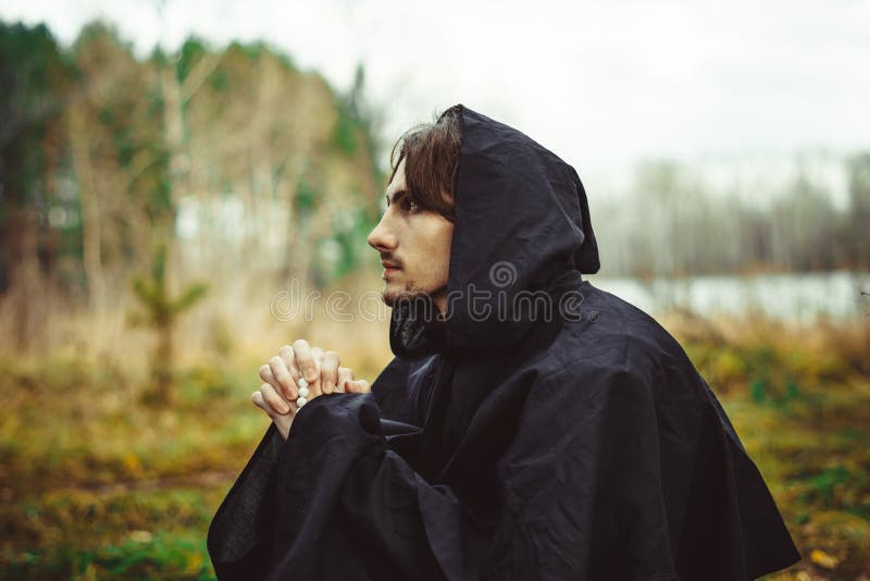 A Monk in Robes Praying in the Woods Stock Image - Image of mystery ...