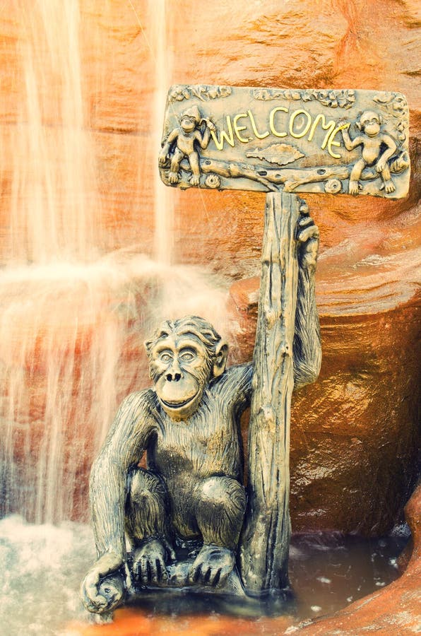 Monkey Statue Holding a Welcome Sign. Stock Image - Image of greeting ...