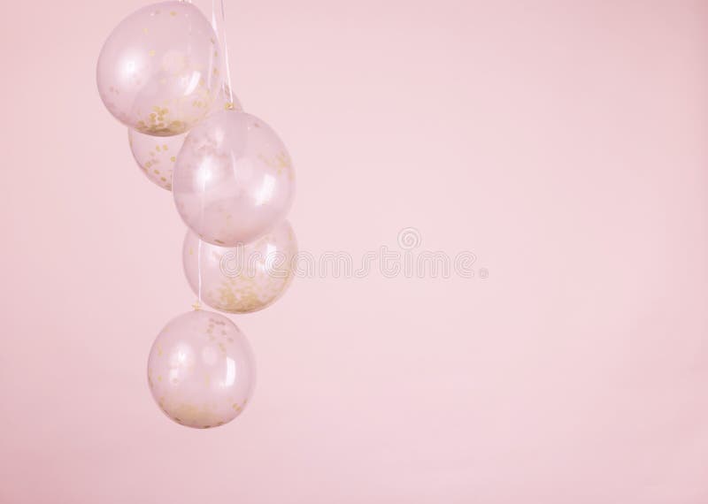 A Monochromatic Pink Confetti Clear Balloons Against a Light Pink ...
