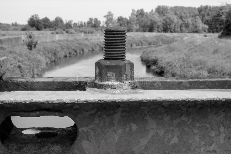 Monochrome Close-up of a Sizable Bolt and Nut on an Aged Bridge ...