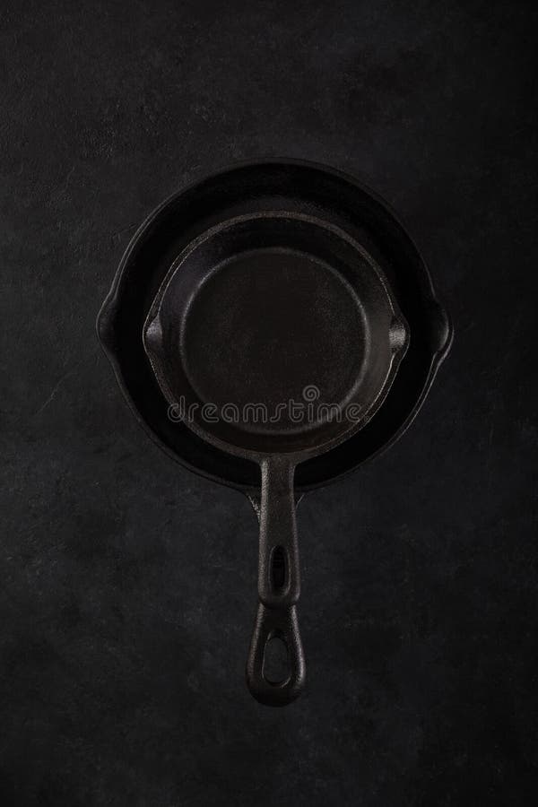 Monochrome Concept. Black Cast Iron Pans on Black Background Stock ...