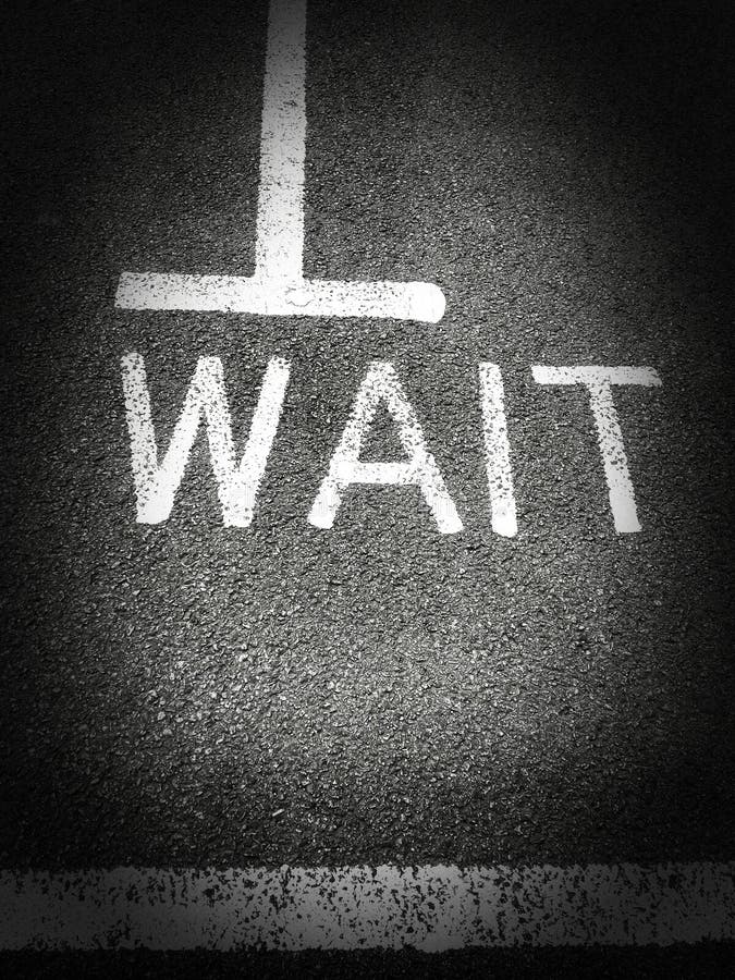 Monochrome Image with Information As Written Text WAIT in White on a ...