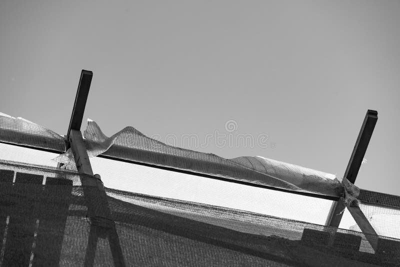 Monochrome Scaffolding with Shadow Protective Mesh Stock Image - Image ...
