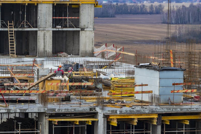 Monolithic Frame Construction of the Building. Workers Working at the ...