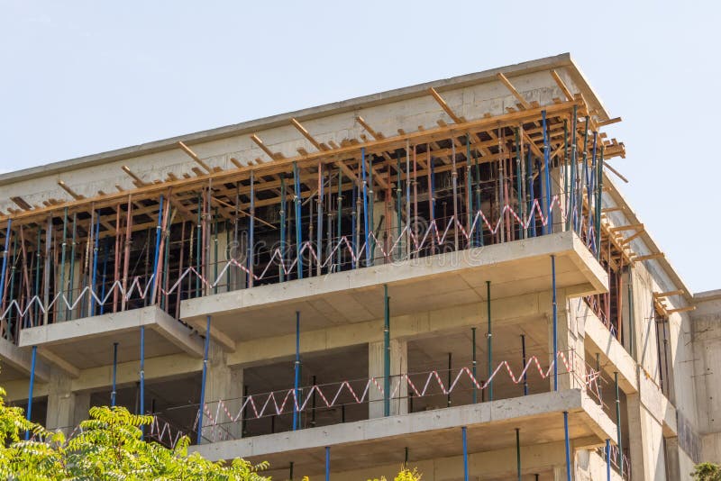 Monolithic House Under Construction. Elements of Wooden Formwork for ...