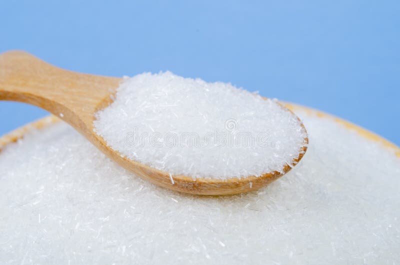 The Monosodium Glutamate on Wooden Spoon on Blue Background MSG Stock ...