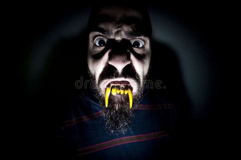 Monstrous Man with Long Teeth Stock Photo - Image of mystery, angry ...